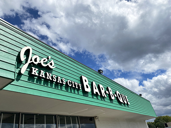 The iconic green exterior of Joe's Kansas City Bar-B-Que stands as a beacon of hope for hungry travelers&mdash;proof that extraordinary food often hides in ordinary places.