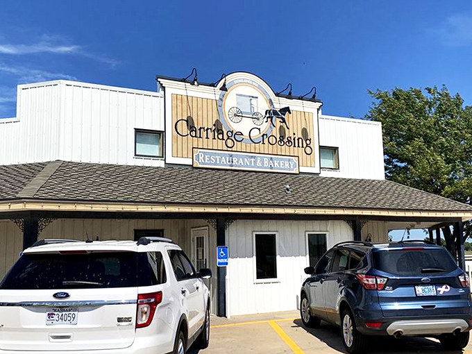 The white exterior of Carriage Crossing stands against a Kansas blue sky like a beacon of comfort food hope in Yoder's Amish country.