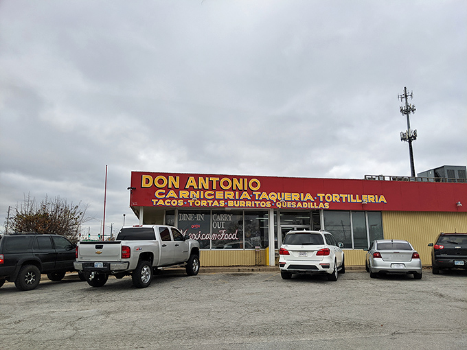 The bright red signage of Don Antonio stands out like a beacon of culinary promise against the Kansas sky, beckoning hungry travelers with its straightforward mission.
