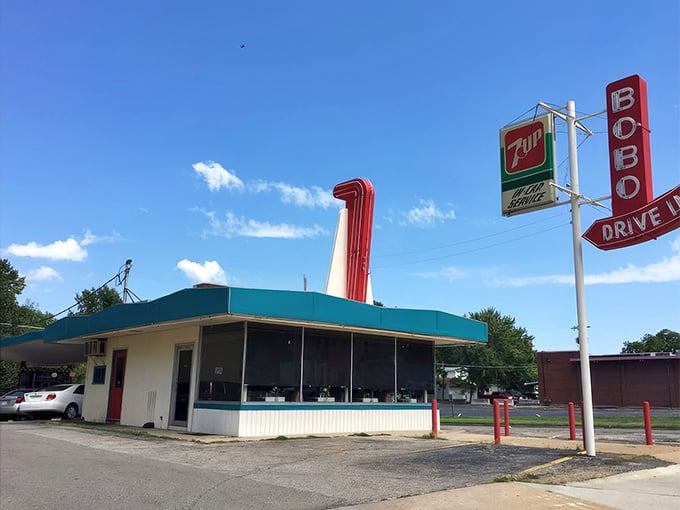 A slice of Americana stands proudly against the Kansas sky, its turquoise trim and cherry-red accents promising delicious nostalgia by the plateful.