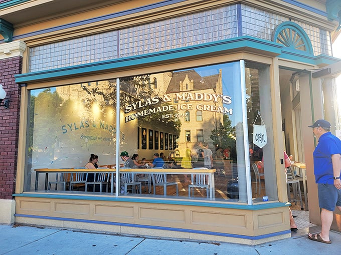 The blue-trimmed storefront of Sylas and Maddy's beckons like a cool oasis on Massachusetts Street, promising sweet relief from Kansas heat.