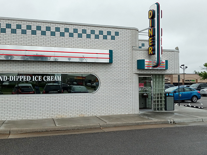 That classic white brick exterior with the checkerboard trim isn't just architecture&mdash;it's a promise of comfort food paradise waiting inside.