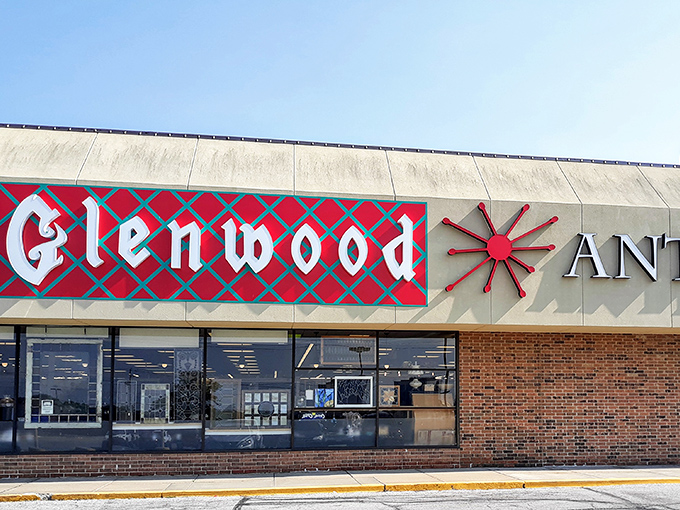 The iconic red and blue sign of Glenwood Antique Mall stands as a beacon to treasure hunters. Like a portal to the past, this unassuming exterior hides a universe of wonders within.