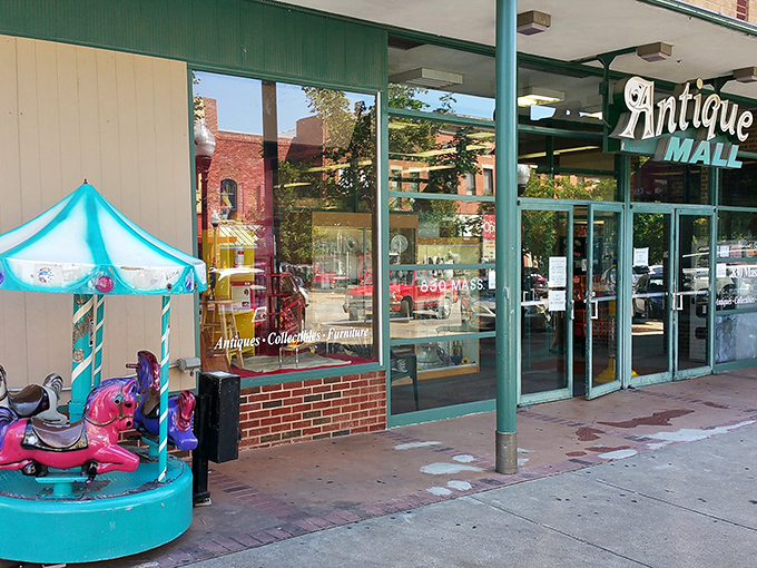 The vintage "Antique Mall" sign beckons like an old friend, promising treasures behind those glass doors on Massachusetts Street.
