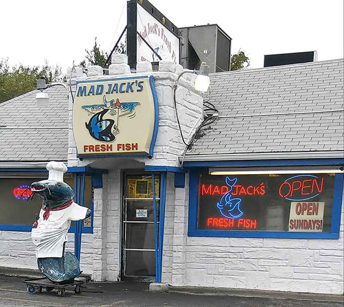 The castle-like exterior of Mad Jack's Fresh Fish stands as a blue-trimmed beacon of seafood hope in landlocked Kansas City.