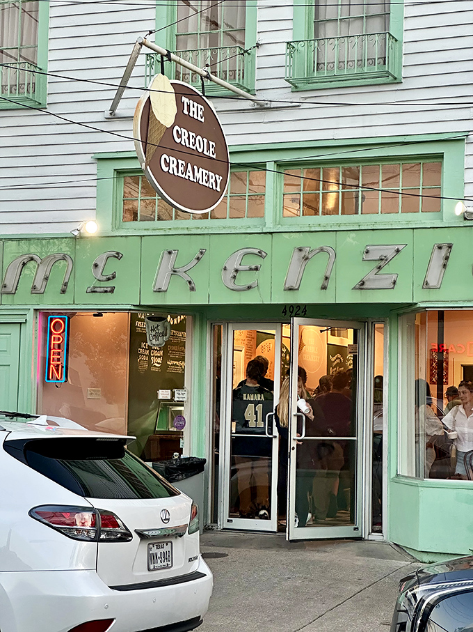 The mint-green facade of Creole Creamery stands like a sweet beacon on Prytania Street, promising frozen happiness within those historic walls.