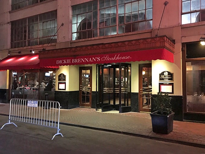 The unassuming red awning of Dickie Brennan's Steakhouse beckons from the historic French Quarter, promising culinary treasures that outshine its modest exterior.