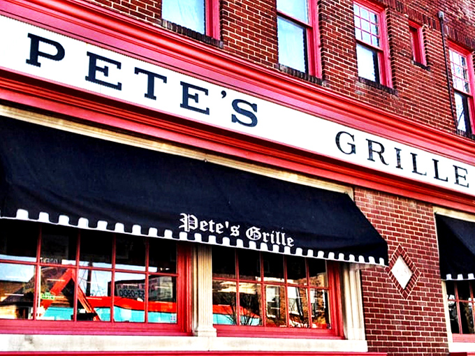 The unassuming brick facade of Pete's Grille stands like a breakfast beacon on Greenmount Avenue, promising honest food without the frills. 
