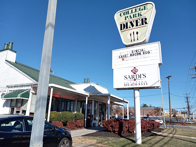 The classic white exterior of College Park Diner stands like a time capsule on Baltimore Avenue, its vintage sign promising comfort food salvation to hungry Marylanders.