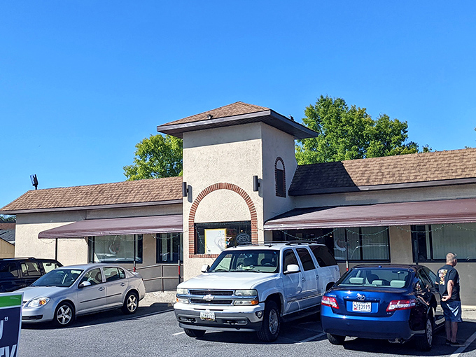 The unassuming exterior of Essex Diner stands like a beacon of comfort food promise. That neon "DINER" sign has been guiding hungry travelers for decades.