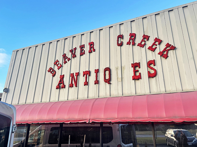 The unassuming exterior of Beaver Creek Antique Market proves that judging books by covers is a rookie mistake. Treasures await behind that bold red signage.