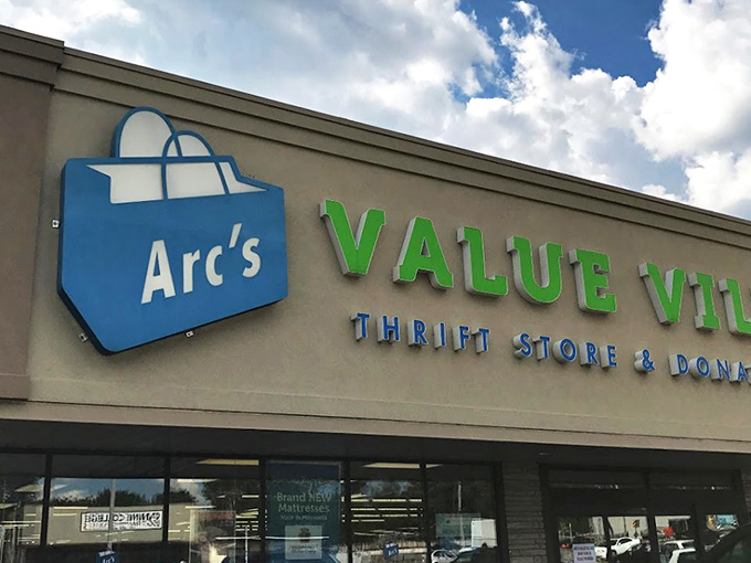 The beige facade with bright blue and green signage isn't just a storefront—it's the gateway to Minnesota's most ambitious treasure hunt.