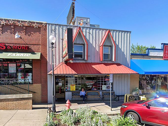 The weathered wood siding and red-trimmed windows aren't trying to impress anyone, yet the line of hungry patrons tells you everything you need to know.