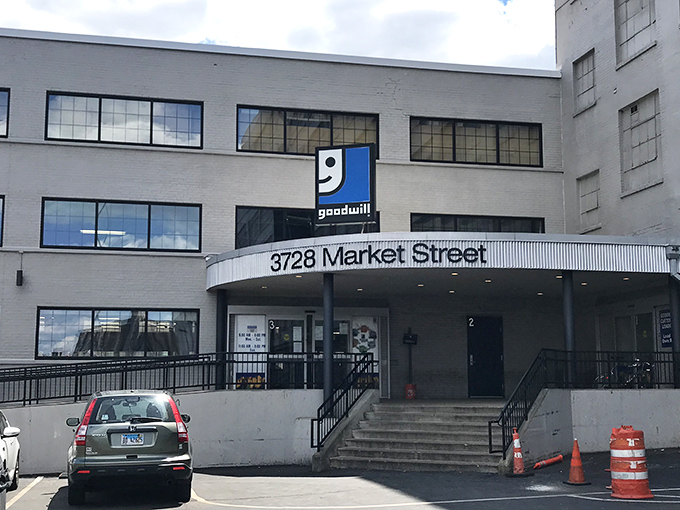 The unassuming exterior of bargain-hunting paradise at 3728 Market Street. Behind these doors, Missouri's most determined thrifters prepare for retail adventure.