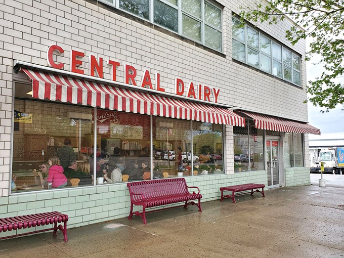 The iconic red-and-white striped awnings of Central Dairy beckon like a dessert lighthouse on Madison Street. Ice cream salvation awaits inside.