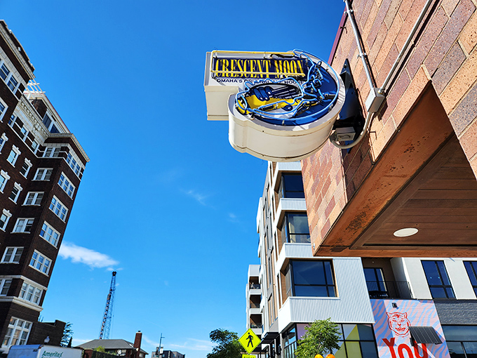 The brick exterior of Crescent Moon beckons like a culinary lighthouse, its blue moon sign promising delicious adventures within Omaha's Blackstone District.