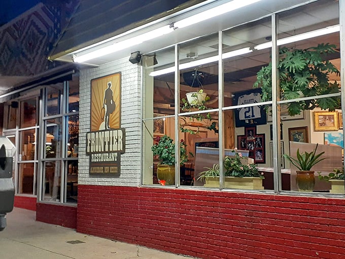 The iconic yellow and red A-frame beckons from Central Avenue like a culinary lighthouse, promising New Mexican treasures inside.
