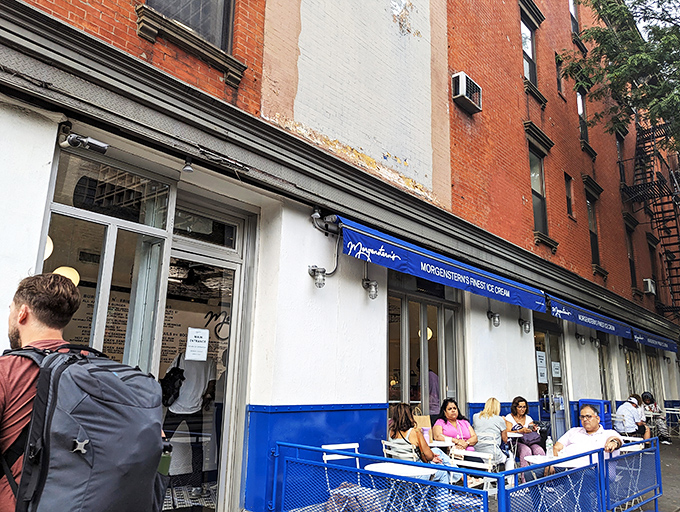 That iconic blue awning against classic New York brick is like a beacon for ice cream pilgrims. Sidewalk seating adds the perfect touch of urban charm.