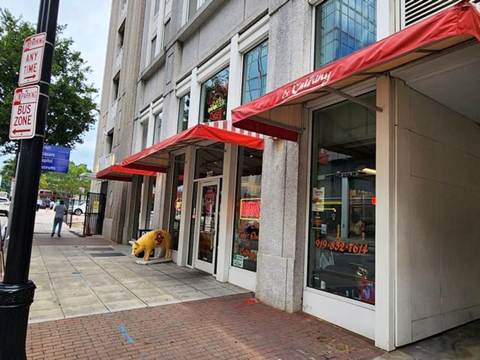 The iconic red awning and pig statue welcome you to Clyde Cooper's, where that neon sign has been promising barbecue bliss since FDR was president.