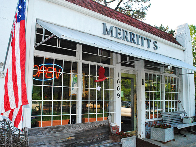The unassuming white building with American flags proudly waving says it all: great food doesn't need fancy architecture, just perfect execution.