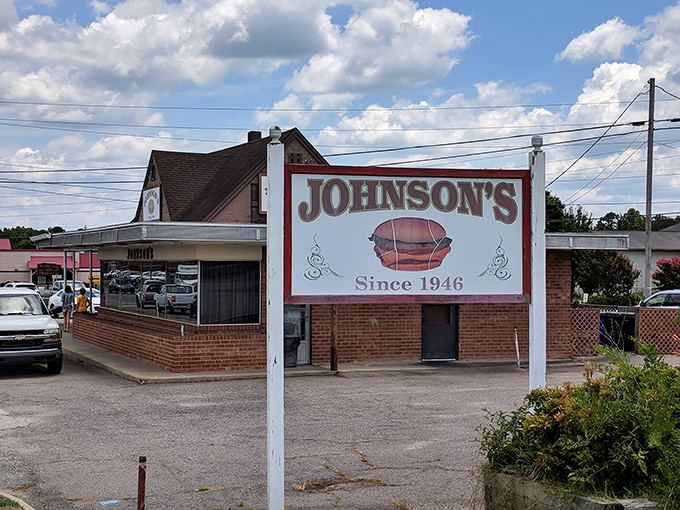 The unassuming exterior of Johnson's Drive-In has welcomed burger enthusiasts since 1946, proving that culinary landmarks don't need flashy facades to become legendary.
