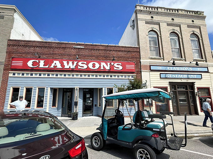 That iconic red Clawson's sign against the historic brick building is like a lighthouse for hungry souls navigating downtown Beaufort.