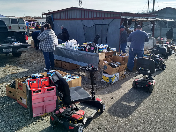 The weekend treasure hunt begins! Shoppers navigate the bustling outdoor section where handmade crafts and fresh finds await discovery.