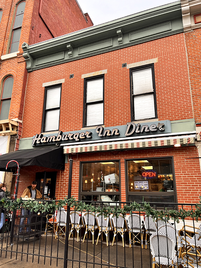 The classic brick fa&ccedil;ade and vintage sign of Hamburger Inn Diner stand as a time capsule on Delaware's main street, beckoning hungry travelers since 1932.