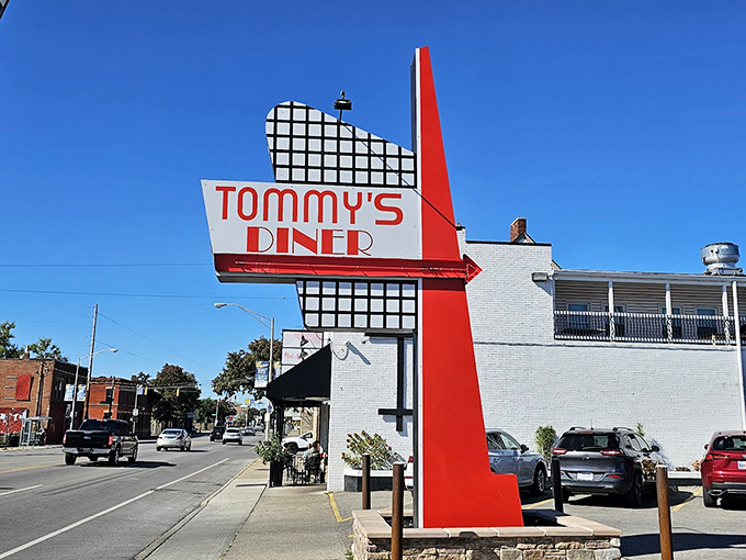 Tommy's Diner stands like a time capsule on West Broad Street, its classic black awning and white brick promising honest-to-goodness comfort inside.
