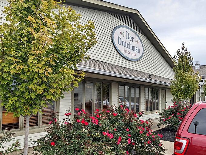 The sunset glow on Der Dutchman's wraparound porch feels like a warm-up act for the comfort food main event waiting inside.