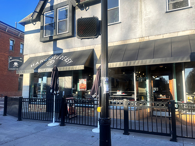 The iconic black awning promises salvation with three simple words: "BREAKFAST CURES ALL." Never has a restaurant sign spoken such profound truth.