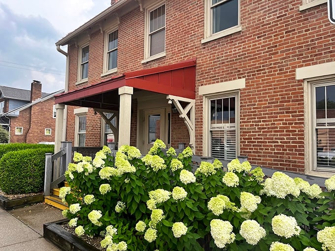 The brick exterior with its welcoming red awning and lush hydrangeas feels like arriving at a friend's house&mdash;if your friend happened to be a barbecue genius.