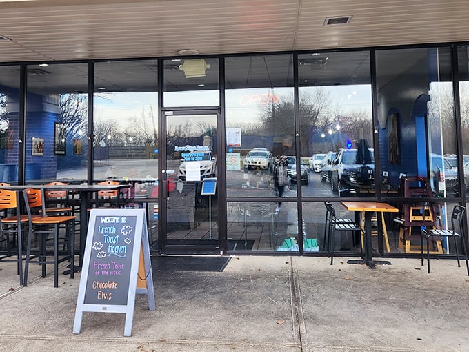 The unassuming storefront might fool you, but that chalkboard sign is basically a treasure map to breakfast nirvana.