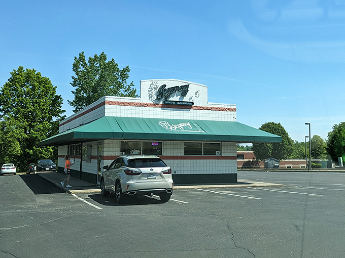 The white-tiled time machine with its signature green awning beckons hungry travelers. This isn't retro by design&mdash;it simply never stopped being wonderful.