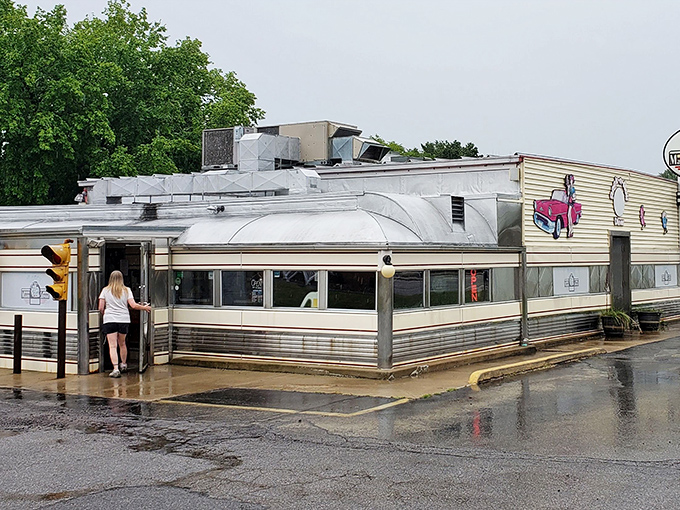 Classic Americana gleams in the rain at Nancy's Main Street Diner, where that stainless steel exterior promises comfort food treasures await inside.