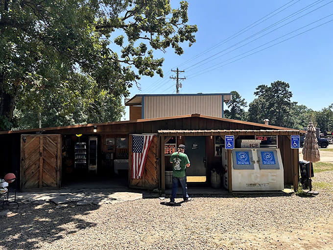 The thatched-roof entrance and rustic wooden exterior of The Hochahut beckons hungry travelers like a tropical oasis in Oklahoma's piney woods.