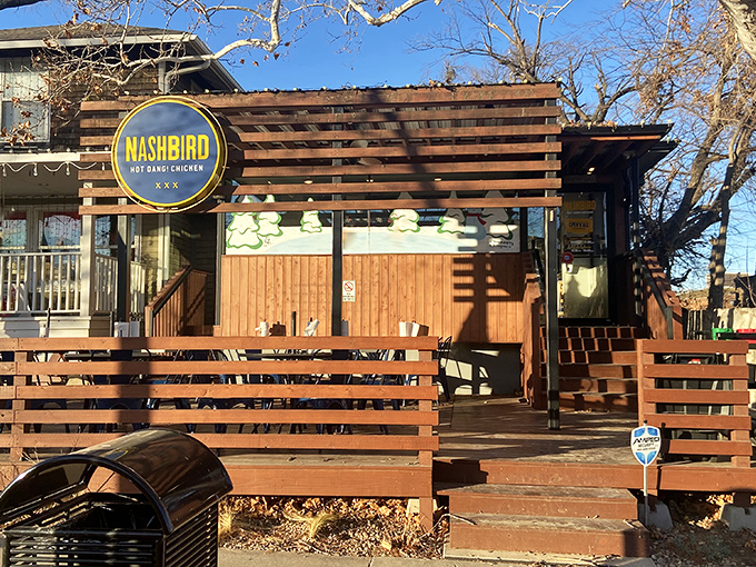 Nashbird's rustic wooden exterior isn't just Instagram-worthy&mdash;it's a siren call to chicken lovers everywhere. The circular yellow sign promises delicious things await.
