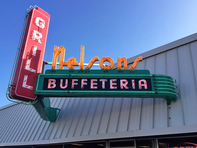 The neon sign at Nelson's Buffeteria glows like a beacon of hope for hungry travelers. This retro masterpiece promises comfort food salvation ahead.