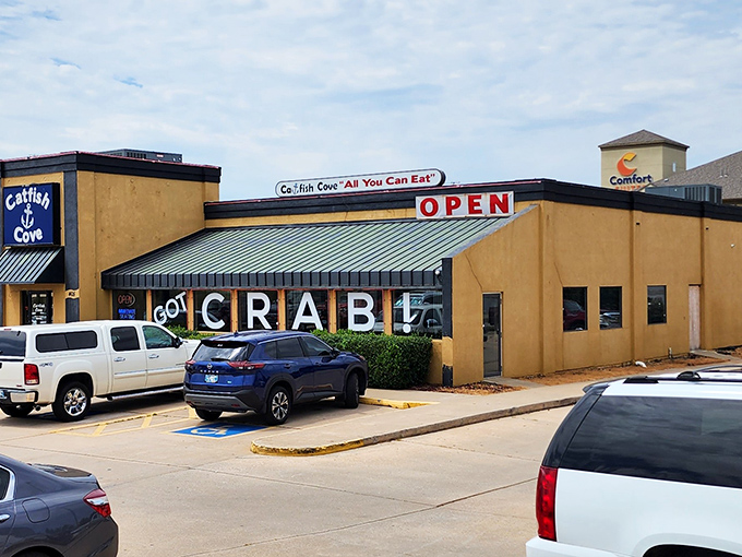 The bright yellow exterior boldly proclaims "GOT CRAB!" like a seafood beacon in landlocked Oklahoma. No pretense, just a promise of oceanic treasures within.