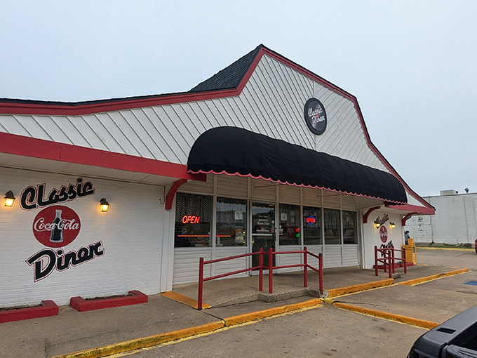 The red and white exterior of Classic Diner stands like a time capsule on Henryetta's landscape, beckoning hungry travelers with its vintage charm and glowing "OPEN" sign.