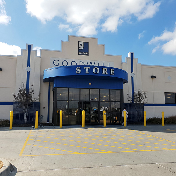 The iconic blue and white facade of Goodwill on Southwest Boulevard stands like a beacon for bargain hunters under Oklahoma's expansive sky.