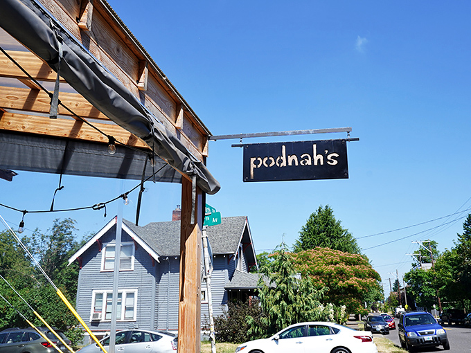 The entrance to barbecue nirvana, flanked by wood cages that aren't just decoration&mdash;they're the secret behind that intoxicating smoke aroma wafting through the neighborhood.