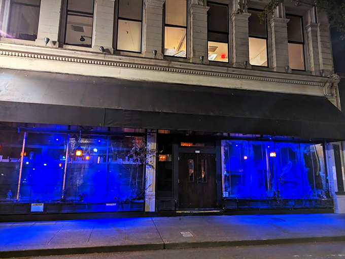 The golden raven beckons from the window, while a creepy doll lurks in the corner. Edgar Allan Poe would approve of this haunting entrance. 