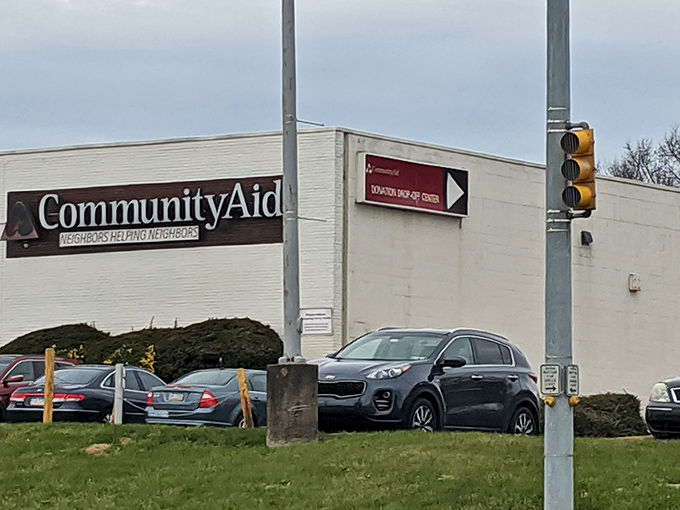 The white brick facade with its distinctive arch isn't just inviting&mdash;it's practically a portal to treasure hunting nirvana. "Neighbors Helping Neighbors" isn't just a tagline, it's a promise.
