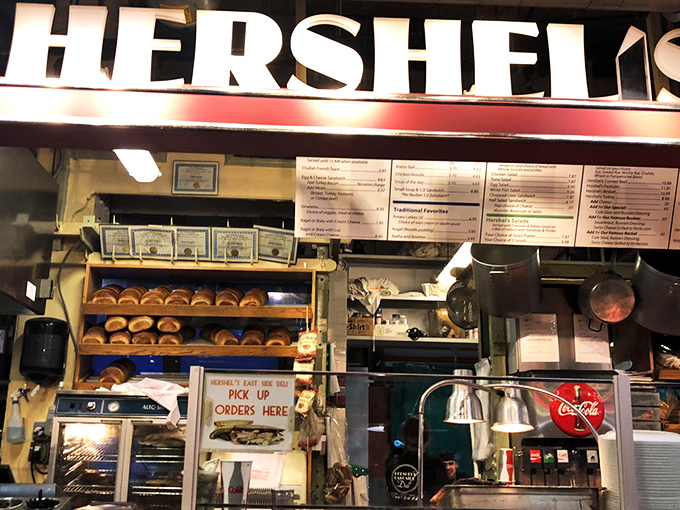 The neon "Deli" sign glows like a beacon of hope for the hungry. At Hershel's counter, sandwich artisans transform simple ingredients into edible masterpieces.