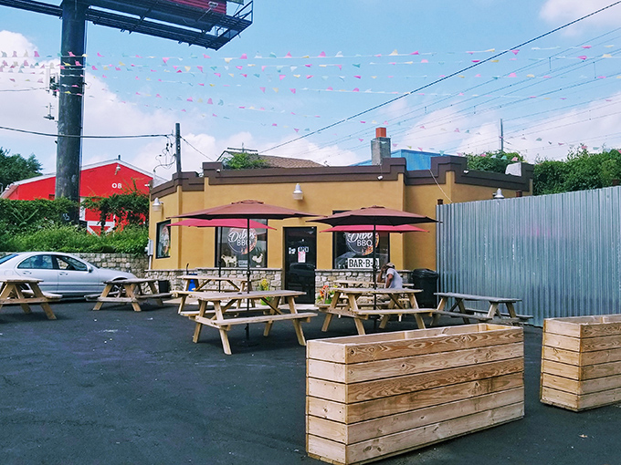 The modest yellow exterior of Dibbs BBQ doesn't scream for attention, but those colorful pennants are like smoke signals beckoning hungry travelers to barbecue paradise. 