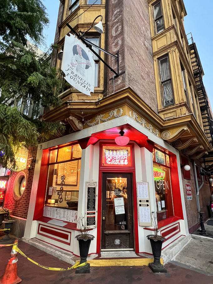 The storefront beckons like a time portal to ice cream's golden age&mdash;ornate yellow cornice, classic signage, and that brick facade promising sweet nostalgia inside.