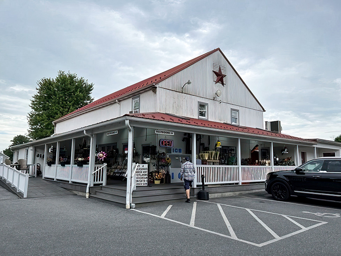The classic white barn with its distinctive red roof stands as a beacon of baked goodness in Bird in Hand, Pennsylvania's rolling countryside.