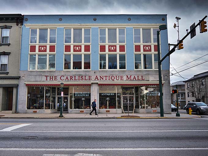 The iconic blue facade of The Carlisle Antique Mall stands proudly on Hanover Street, a time capsule waiting to be explored.