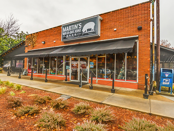 The red brick exterior of Martin's Bar-B-Que Joint beckons hungry pilgrims with its no-nonsense fa&ccedil;ade and the promise of smoky delights within.